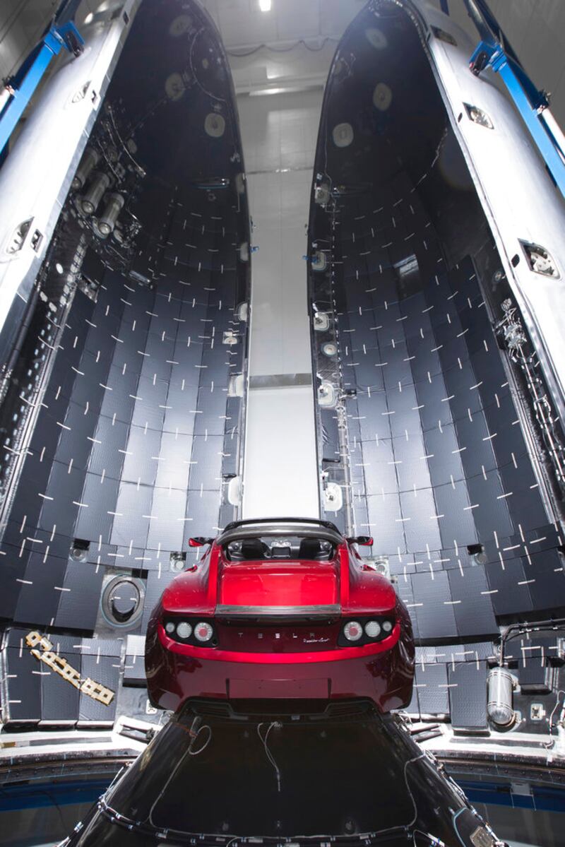SpaceX's big new rocket blasts off, puts sports car in space